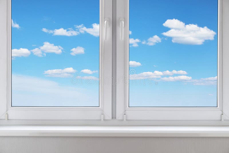 White Plastic Window with a Bright Blue Sky and Fluffy White Clouds ...