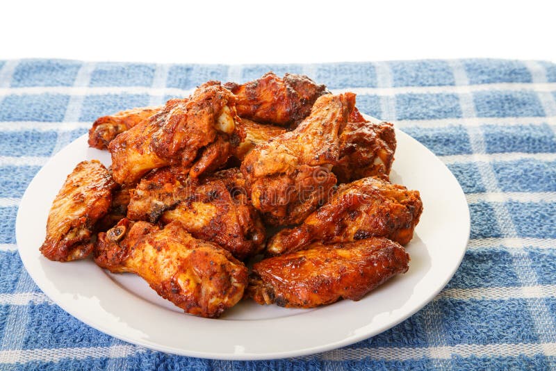 White Plate of Chicken Wings on Blue Mat Stock Photo - Image of backed ...