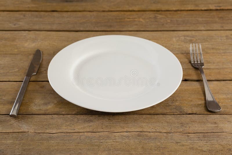 White Plate with Cutlery on Table Stock Image - Image of plate, cutlery ...