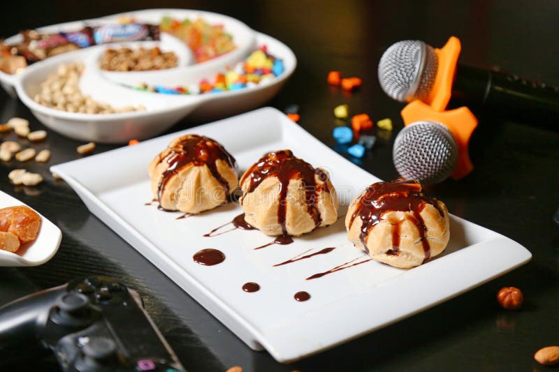 White Plate with Desserts Next To Microphone Stock Photo - Image of ...