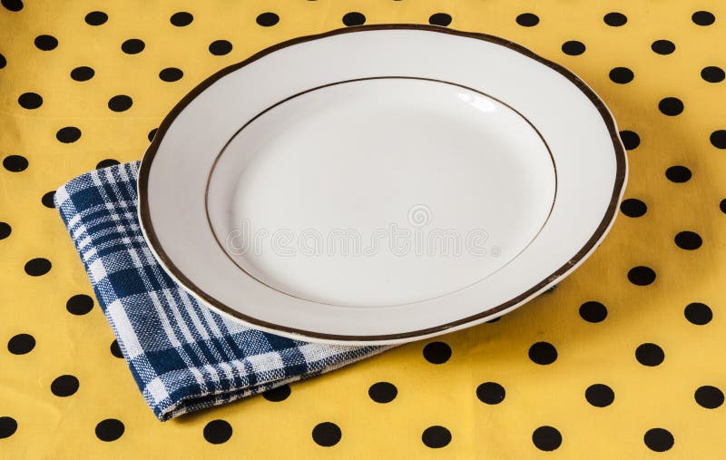 White Plate on Light Yellow Polka Dot Background Stock Image - Image of ...
