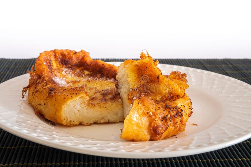 A White Plate with a Piece of Bread Pudding on Top Stock Image - Image ...