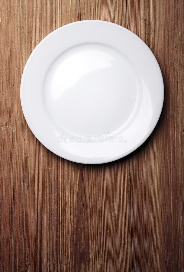 White plate on wood table stock photo. Image of wooden - 26189260