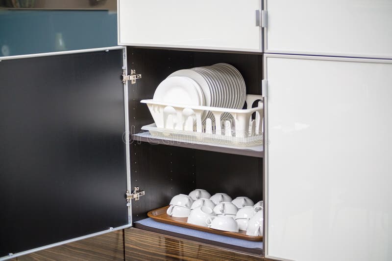 White Plates and Coffee Cups in the Cupboard on the Shelf Stock Image ...