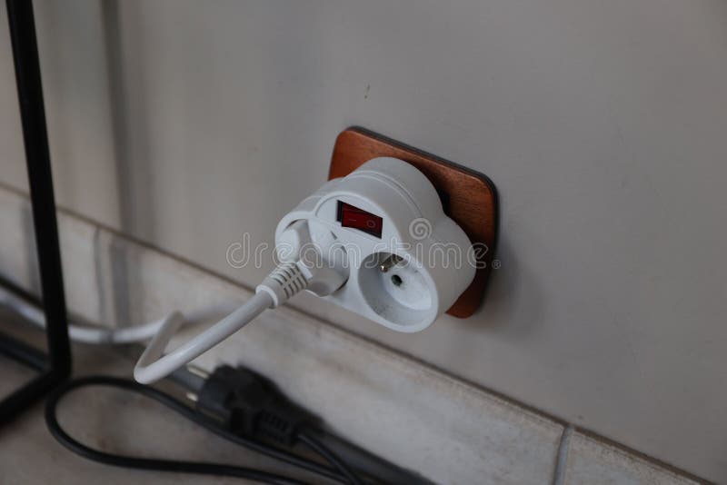White plug in wall socket stock photo. Image of plug - 152406930