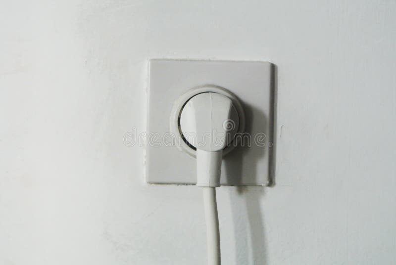 White plug in wall socket stock photo. Image of plug - 152406930