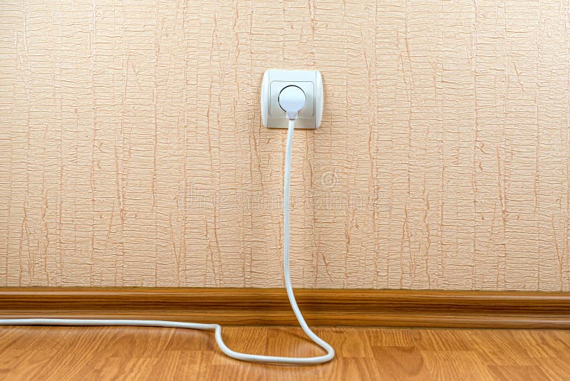 The White Plug with a Wire is Connected To a White Socket Stock Image ...