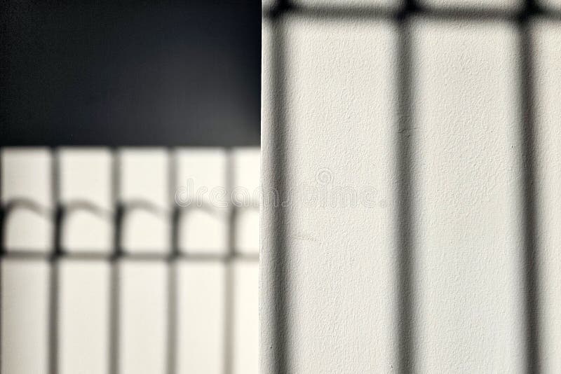 White Pole and Gray Wall Background with Light and Shadow Fence on the ...