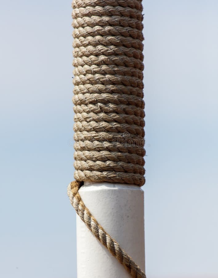 A White Pole with a Rope Wrapped Around it Stock Photo - Image of ...
