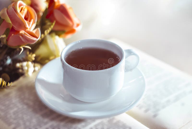 White Porcelain Cup. Open Book. Decorative Flowers Stock Image - Image ...