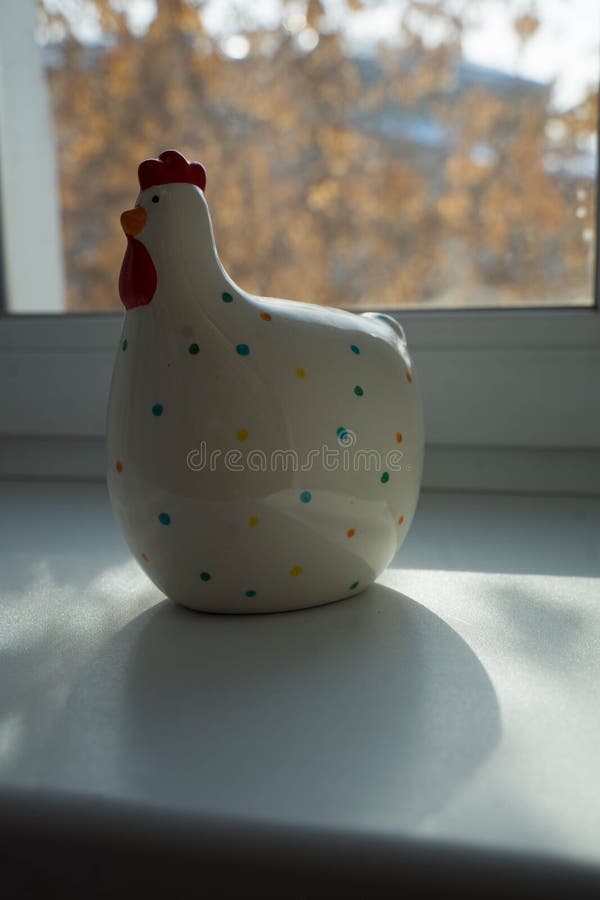 White Porcelain Chicken Stands on the Window Stock Image - Image of ...