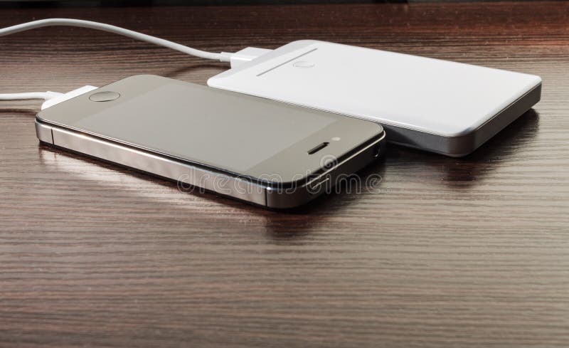 White Portable Power Bank and Mobile Phone Stock Image - Image of ...