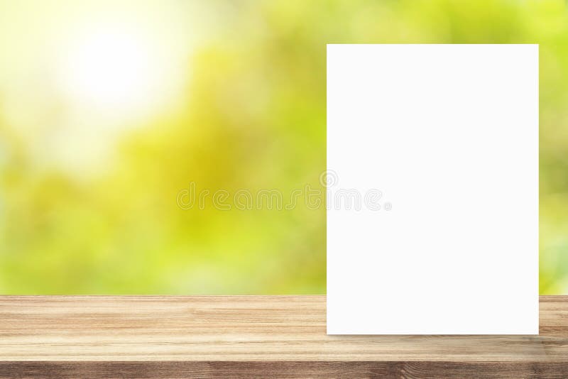 White Poster Paper Template is on Top of Wood Table Stock Image - Image ...
