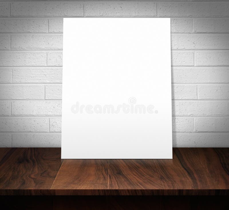 The White Poster on a Wooden Table with Brick Wall Stock Photo - Image ...