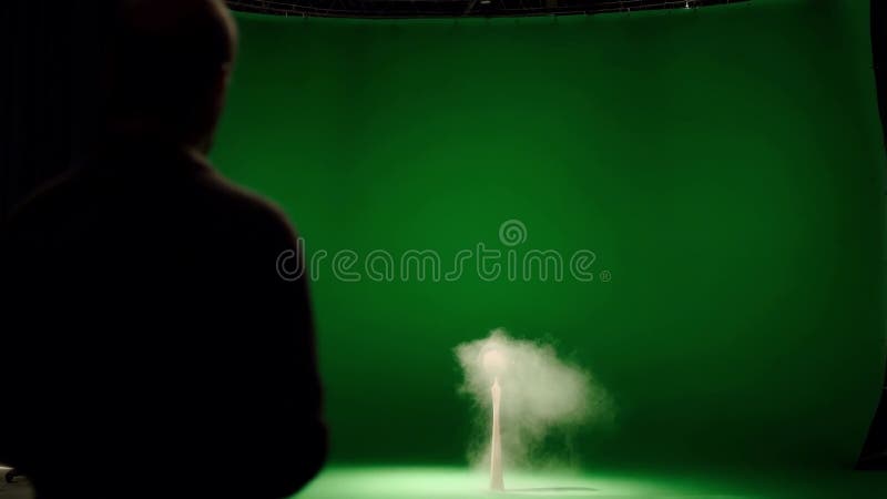 White Powder Explosion on Green Screen Background with Technician Stock ...