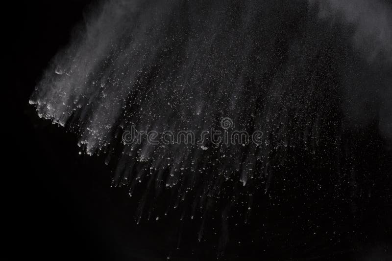 Freeze Motion of White Color Powder Exploding on Black Background ...