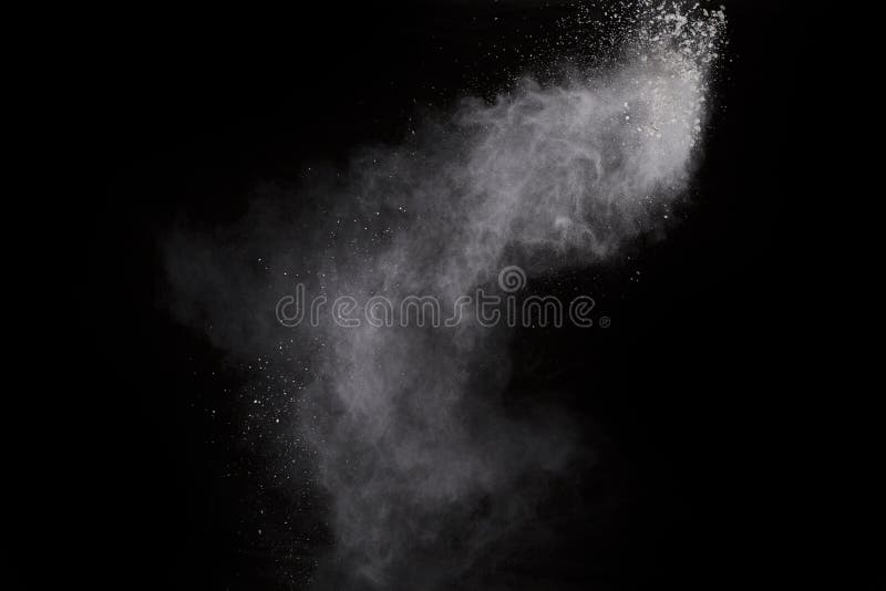 Freeze Motion of White Color Powder Exploding on Black Background ...