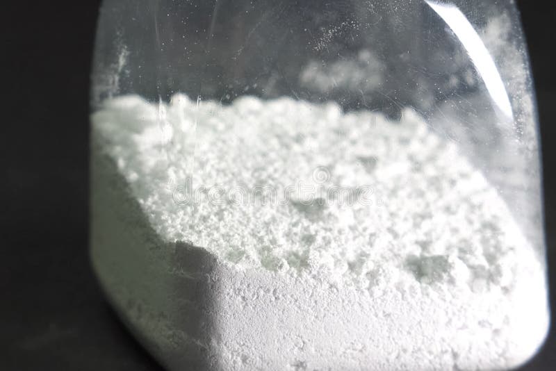 White Powder in Transparent Jar. White Powder on the Table Stock Photo ...