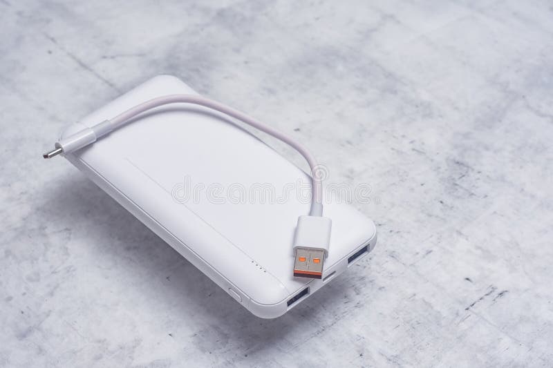 White Power Bank on a Marble Table. Portable Charger for Gadgets. Stock ...