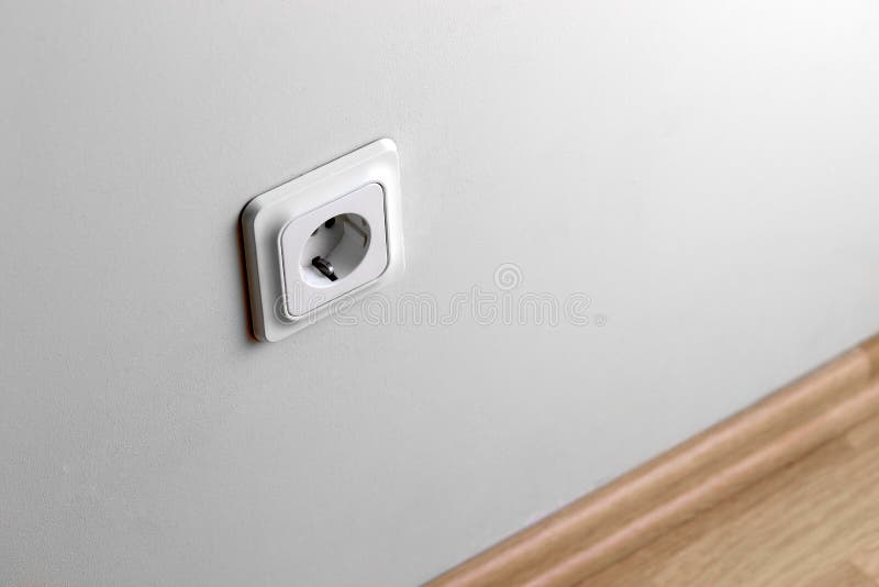 White Power Socket on Wall at Low Height from the Floor Stock Photo ...