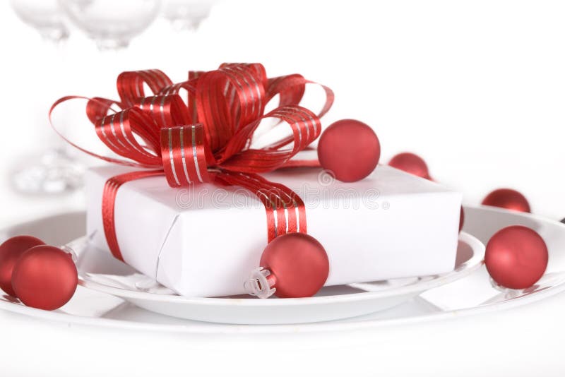White Present with Red Ribbons on a Dinner Plate Stock Image - Image of ...