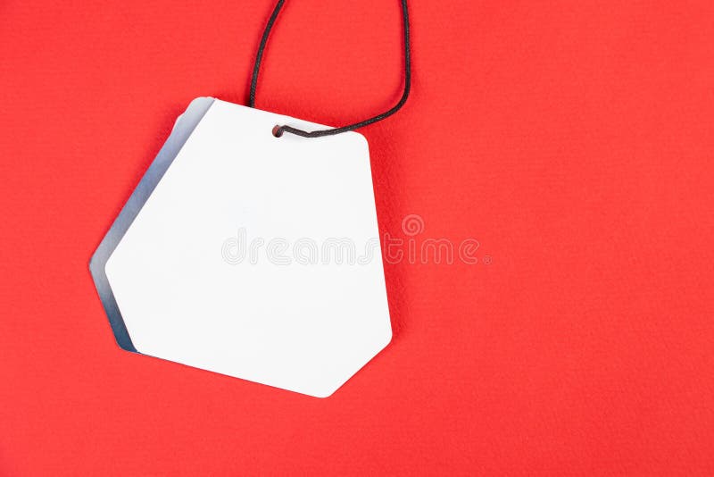 White Price Tag on a Red Isolated Background, Price Tag for Goods Stock ...