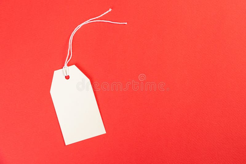 White Price Tag on a Red Isolated Background, Price Tag for Goods Stock ...