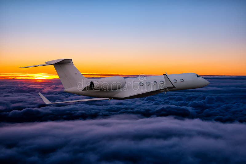 White Private Jet Flies in the Sunset Sky Stock Photo - Image of ...