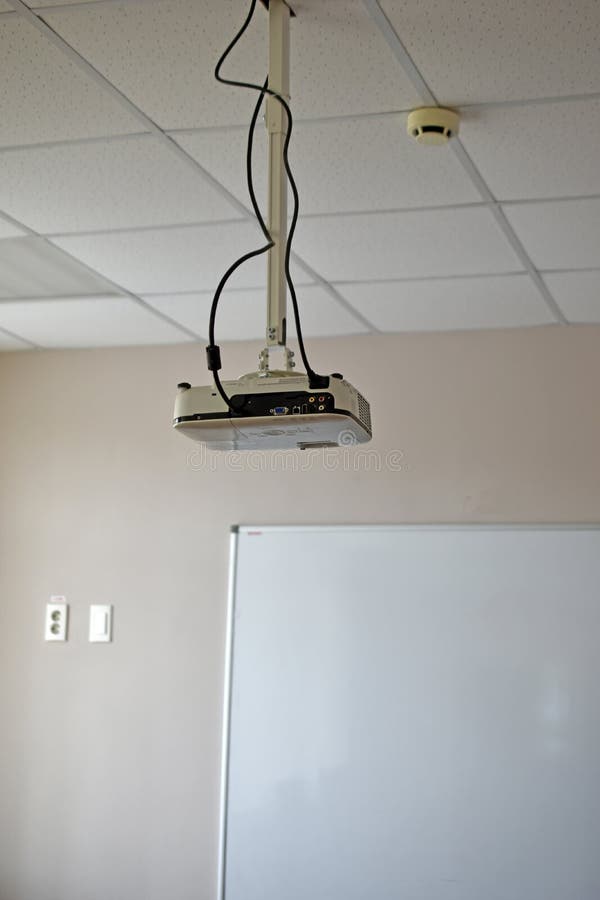 A White Projector in a Small Hall in the School Opposite the Blackboard ...
