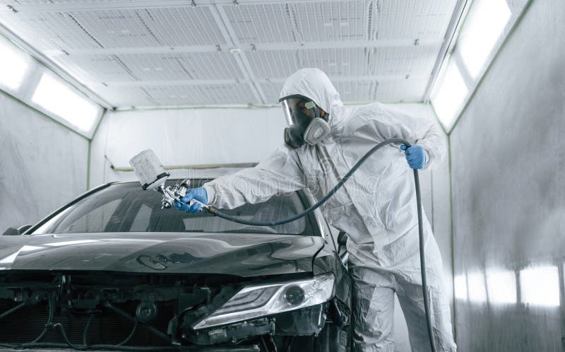 White Protective Wear. Man is Painting a Car by Using Spray Guy Stock ...