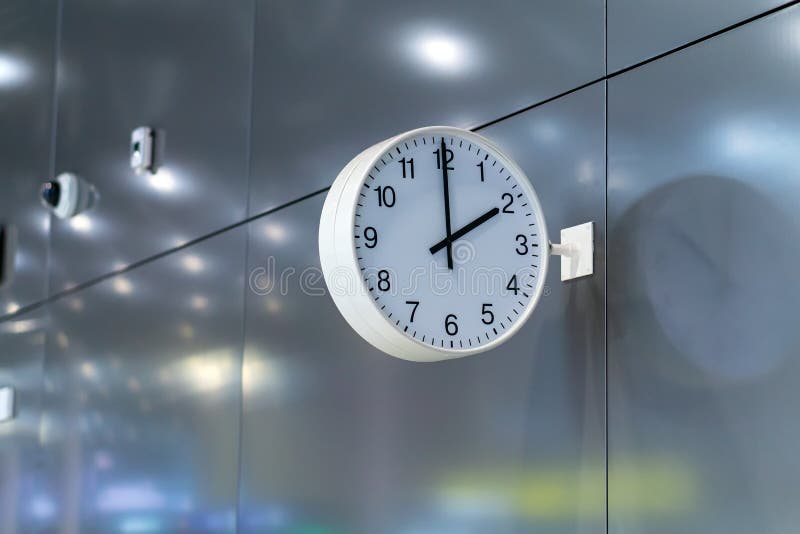 A White Public Clock on a Metal Wall. Stock Image - Image of metal ...