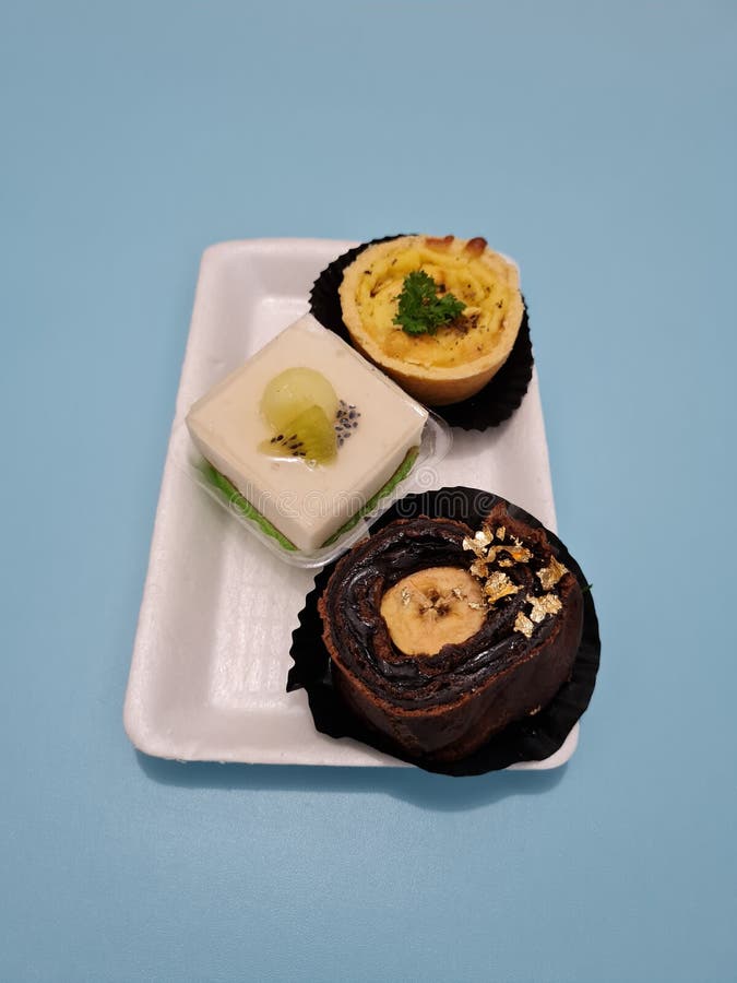 White Pudding, Egg Rolls, Chocolate Filled with Bananas Stock Image ...