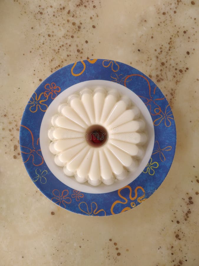 White Pudding on a Cute Plate with Flower Pattern Stock Photo - Image ...