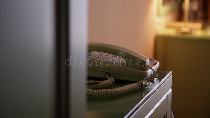 White Push-button Telephone in Hotel Room for Communication with the ...
