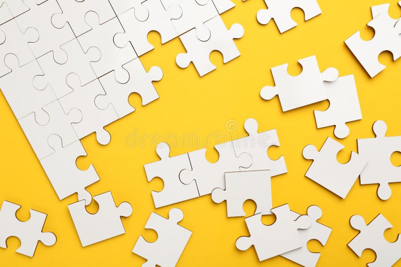 White Puzzle Pieces on Yellow Background, Top View Stock Photo - Image ...