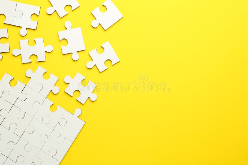 White Puzzle Pieces on Yellow Background, Top View. Space for Text ...