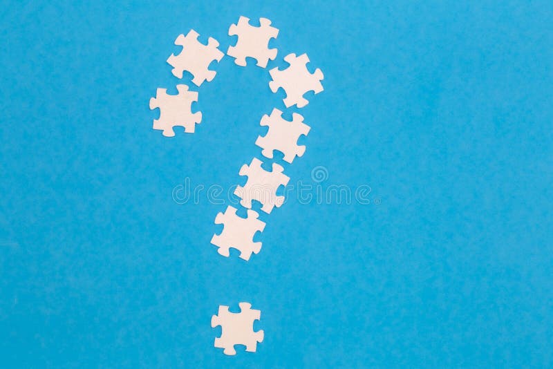 White Puzzles in the Shape of a Question Mark on a Blue Background ...