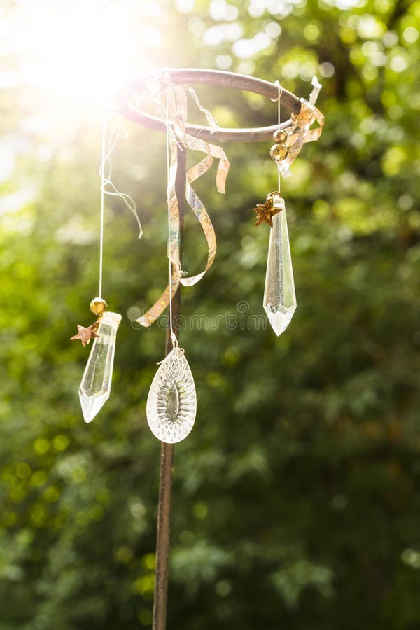 White Quartz Crystals Hanging on Strings Over Nature Background Stock ...