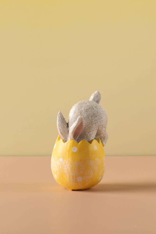 A White Rabbit Hid in an Easter Egg on a Yellow Background. Festive ...