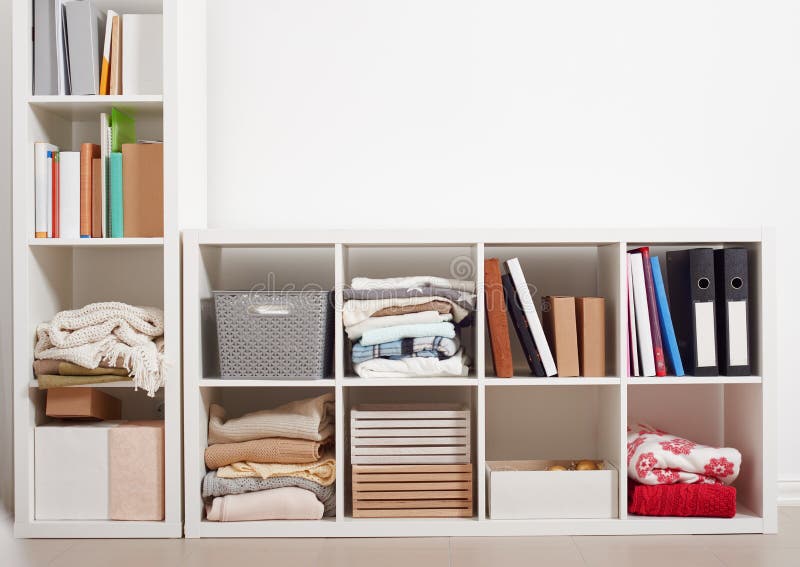 White Rack with Shelves Full of Stuff Stock Image - Image of paper ...