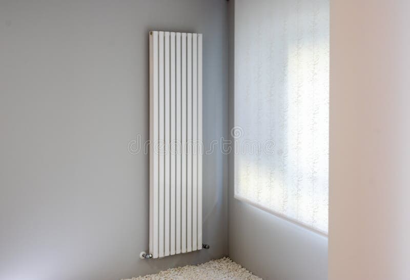 White Radiator on Gray Wall with Window Stock Photo - Image of indoor ...