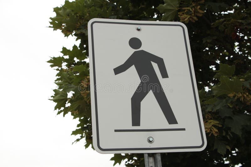 White Rectangle Sign with Black Illustration of Person Walking on Flat ...