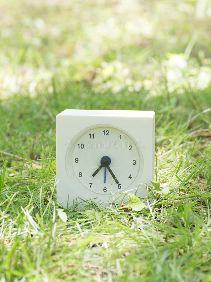 White Simple Clock on Lawn Yard, 7:25 Seven Twenty Five Stock Photo ...