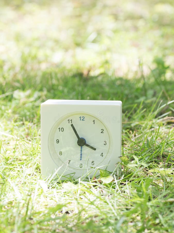 White Simple Clock on Lawn Yard, 3:55 Three Fifty Five Stock Photo ...