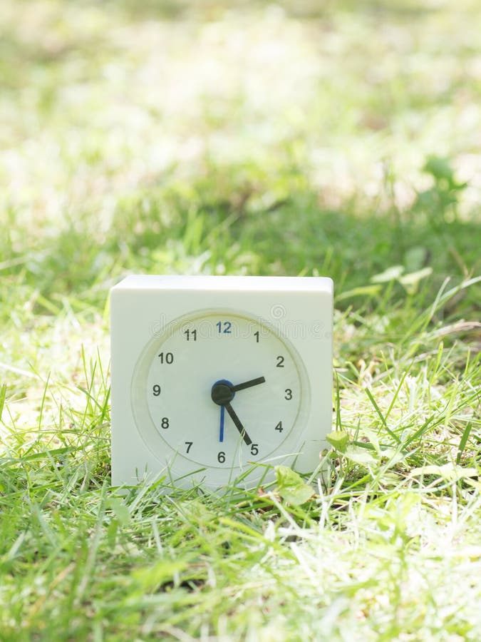 White Simple Clock on Lawn Yard, 2:25 Two Twenty Five Stock Photo ...