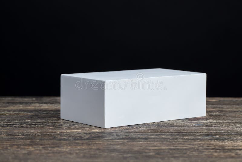 A White Rectangular Box on a Black Board Stock Photo - Image of board ...