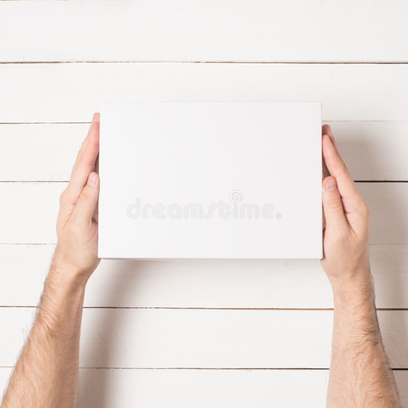 White Rectangular Box in Male Hands. Top View Stock Image - Image of ...