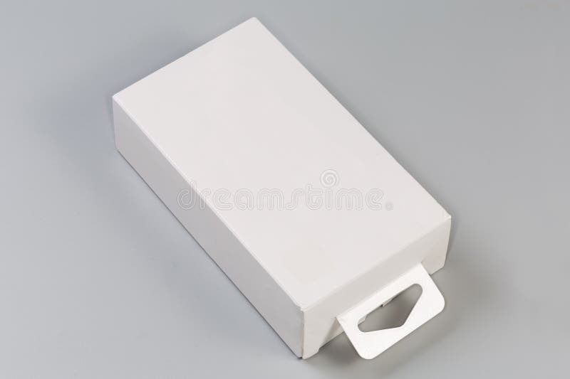 White Rectangular Cardboard Hang Tab Packing Box on Gray Surface Stock ...