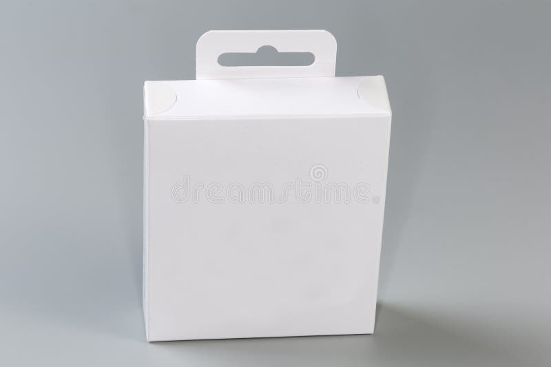 White Rectangular Cardboard Hang Tab Packing Box on Gray Surface Stock ...