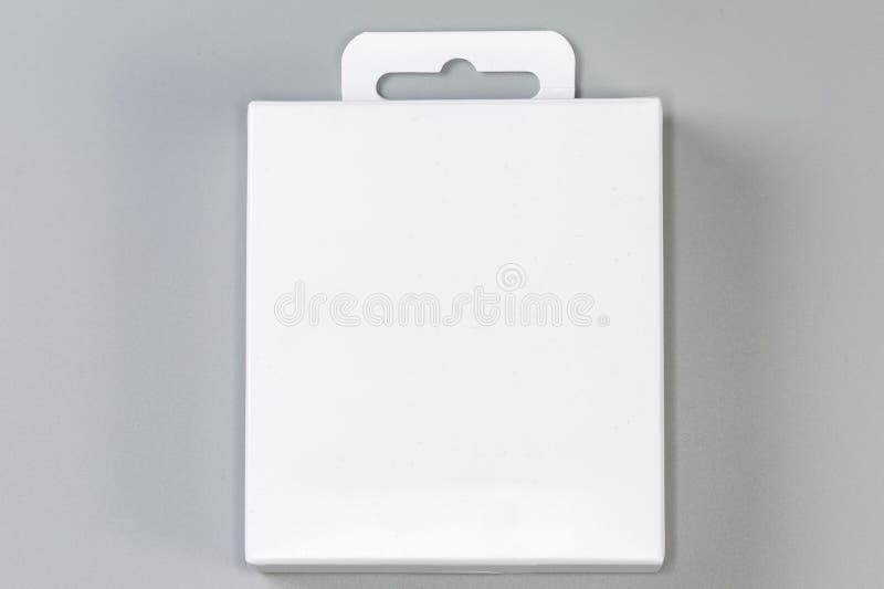 White Rectangular Cardboard Hang Tab Packing Box on Gray Surface Stock ...